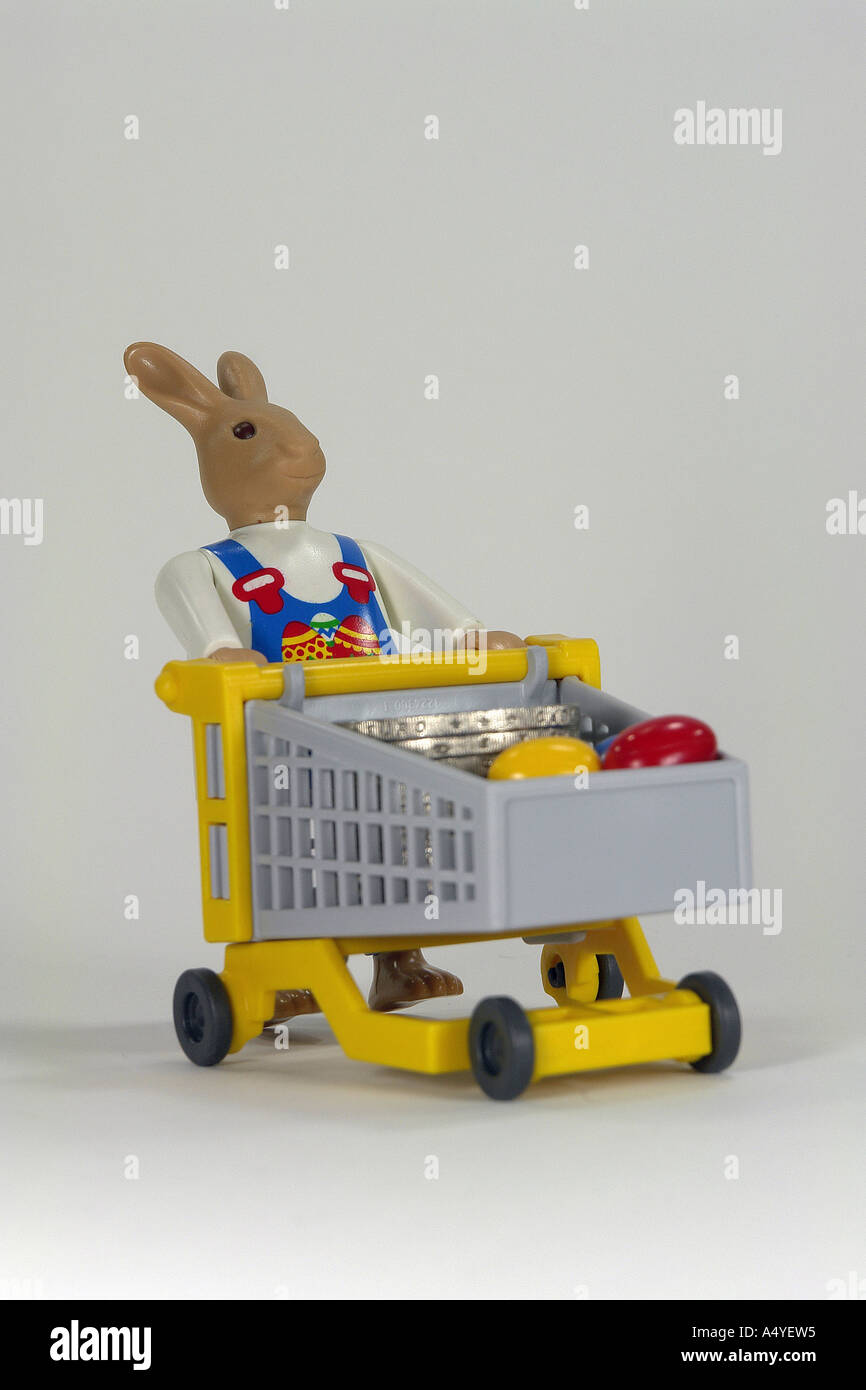 Easter bunny with euro coins as symbole for expensive easter shopping ...