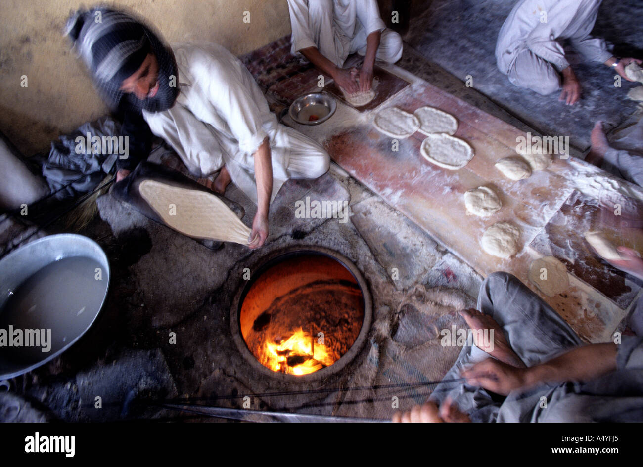 Kabul, Bread bakers at work Stock Photo - Alamy