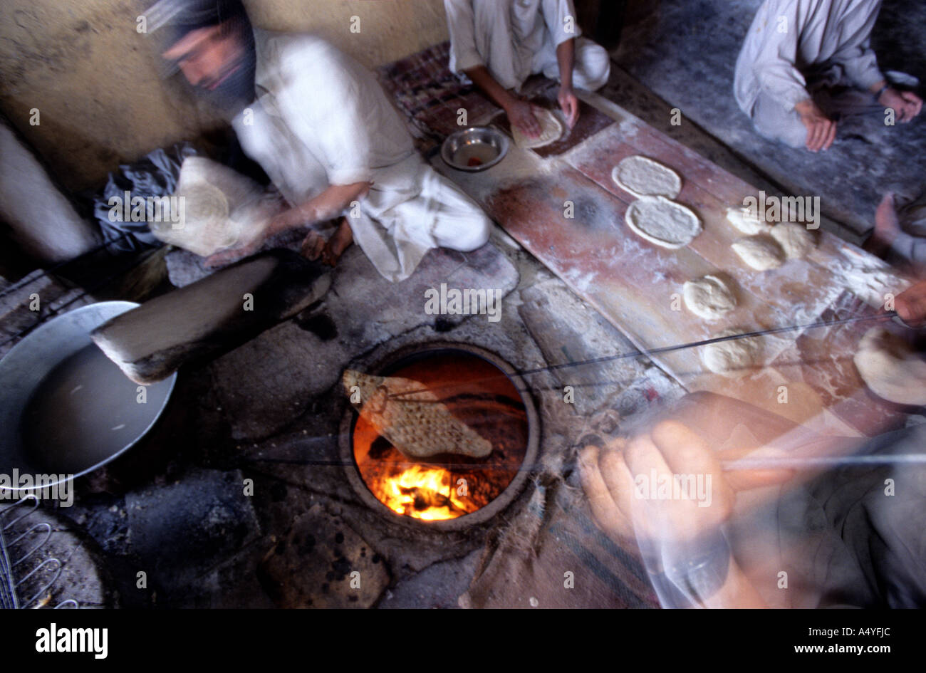 Kabul, Bread bakers at work Stock Photo - Alamy