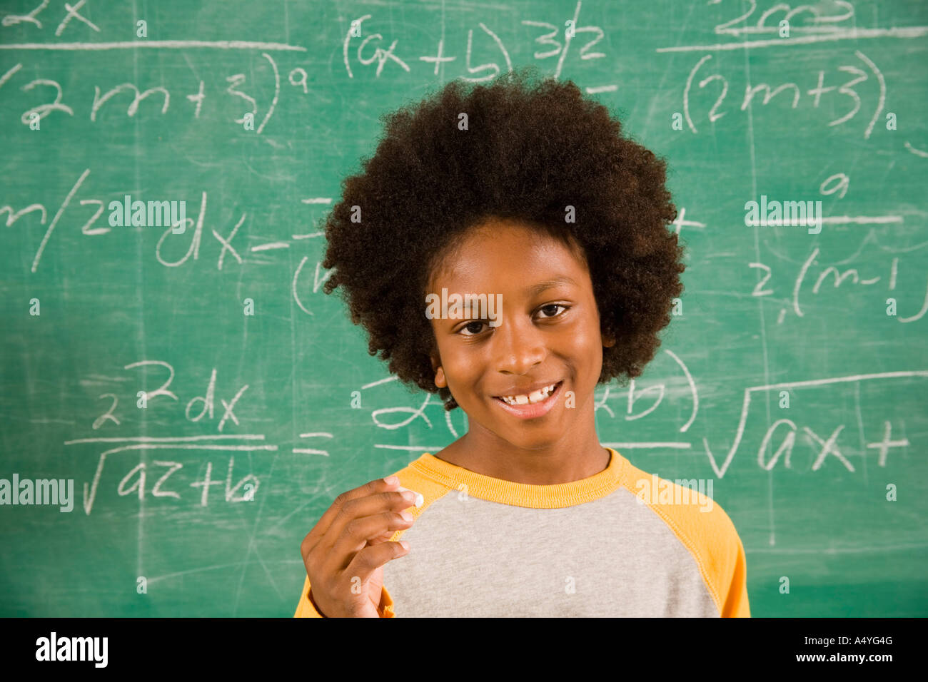 Portrait of boy in front of math on blackboard Stock Photo - Alamy