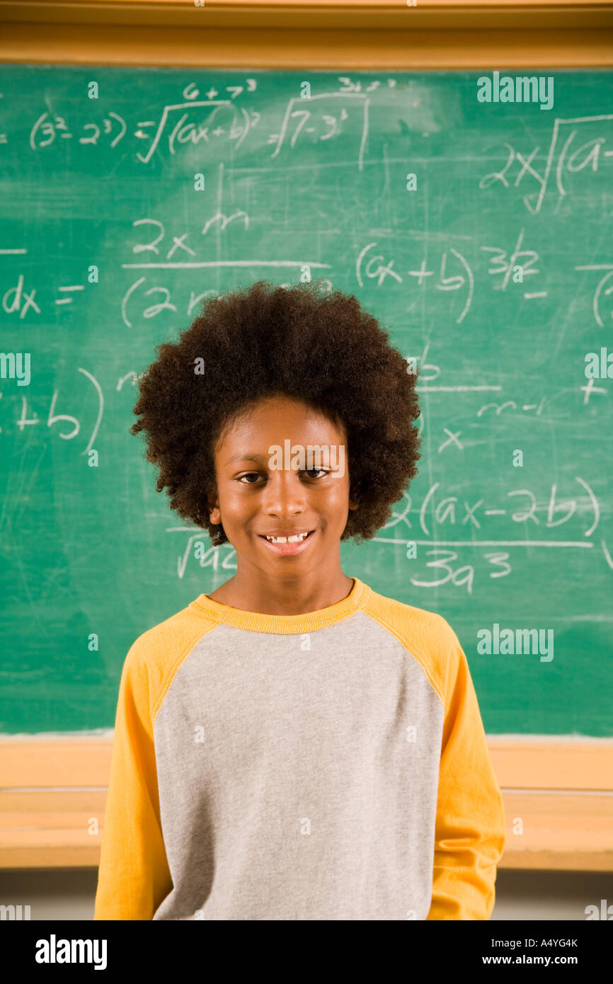 Portrait of boy in front of math on blackboard Stock Photo - Alamy