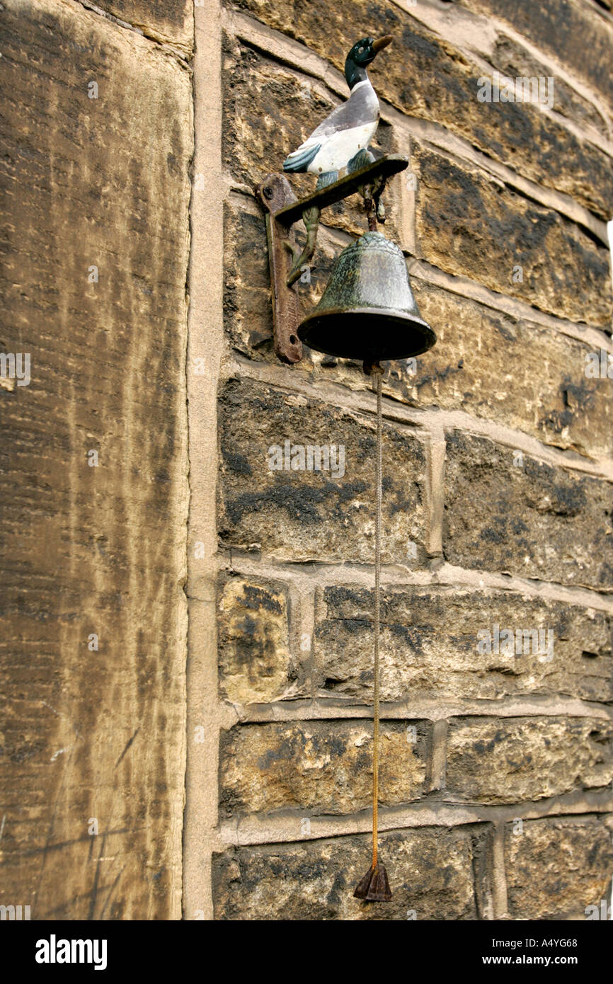 Typical English home chilly rainy weather metal bell toll ring the bell ...