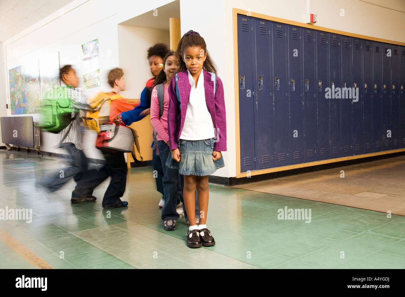 Blurred motion shot of students running into line Stock Photo - Alamy