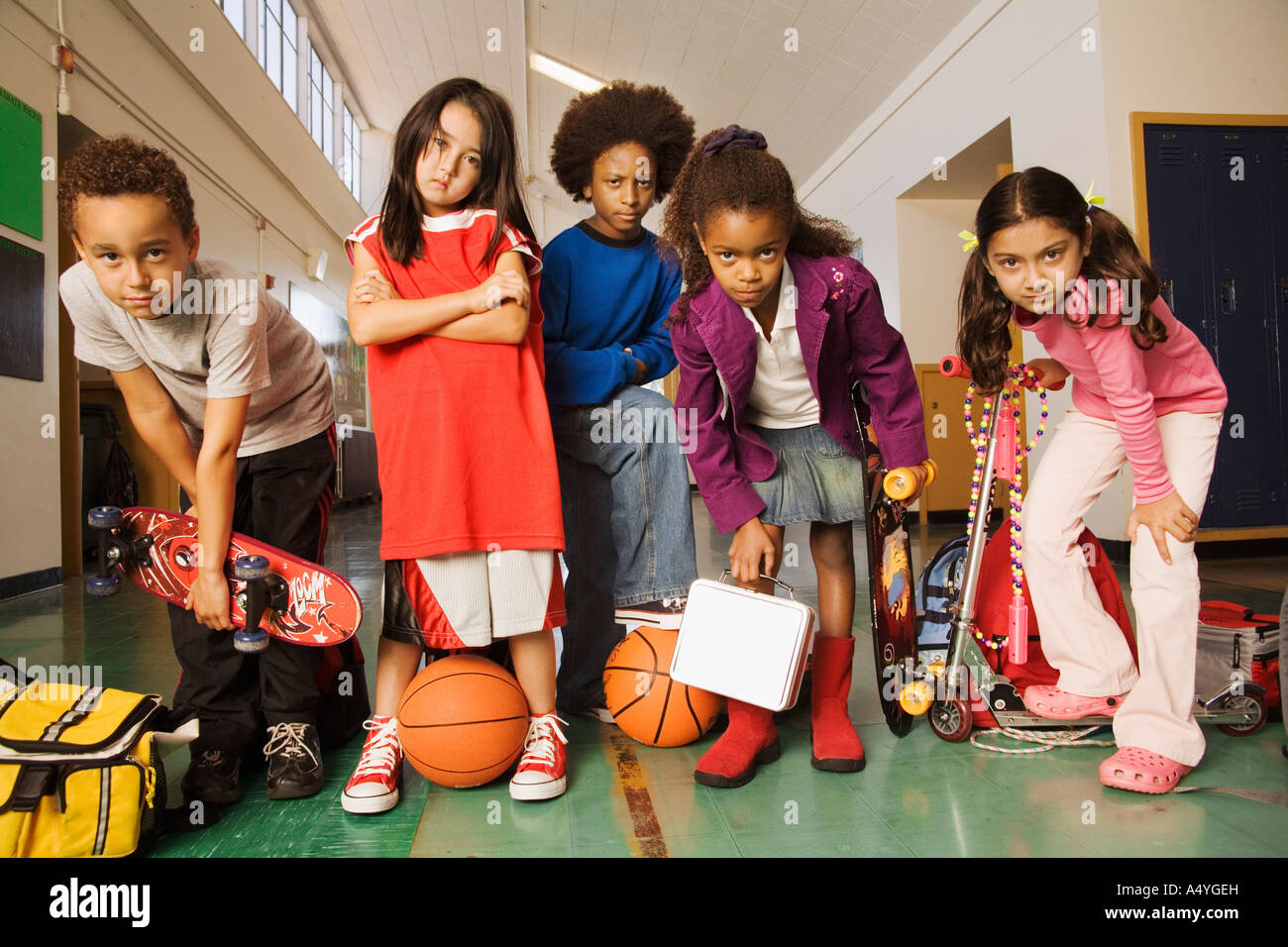 Group of students with sports equipment in hallway Stock Photo - Alamy