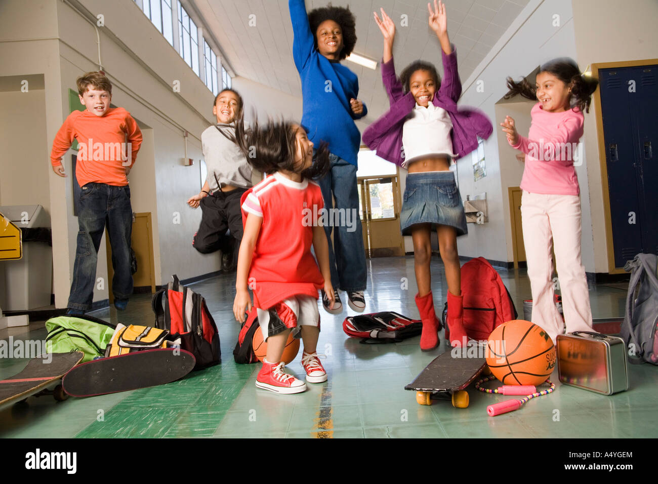 Group of students cheering in hallway Stock Photo - Alamy