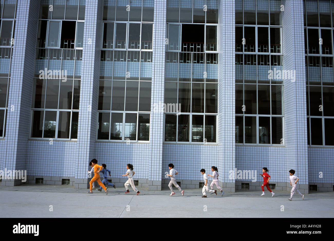 Children practice gymnastics at the Li Xiaoshuang Gymnastics School in ...
