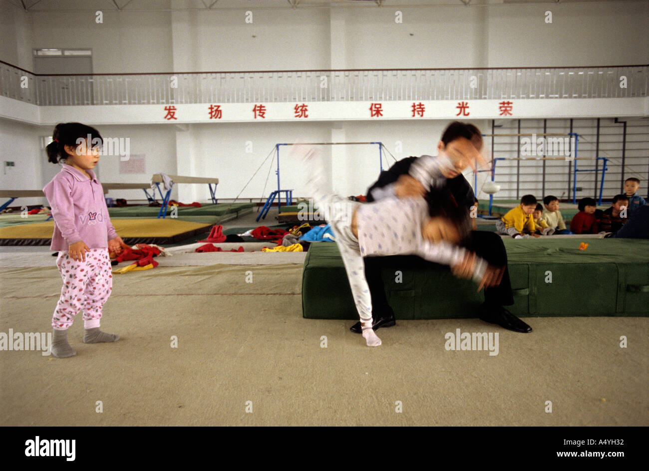 Children practice gymnastics at the Li Xiaoshuang Gymnastics School in ...