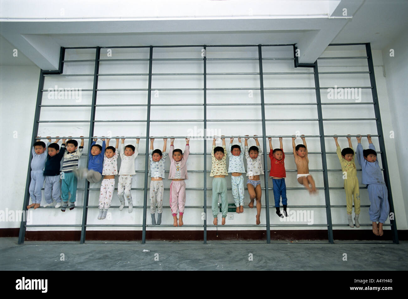 Children practice gymnastics at the Li Xiaoshuang Gymnastics School in ...