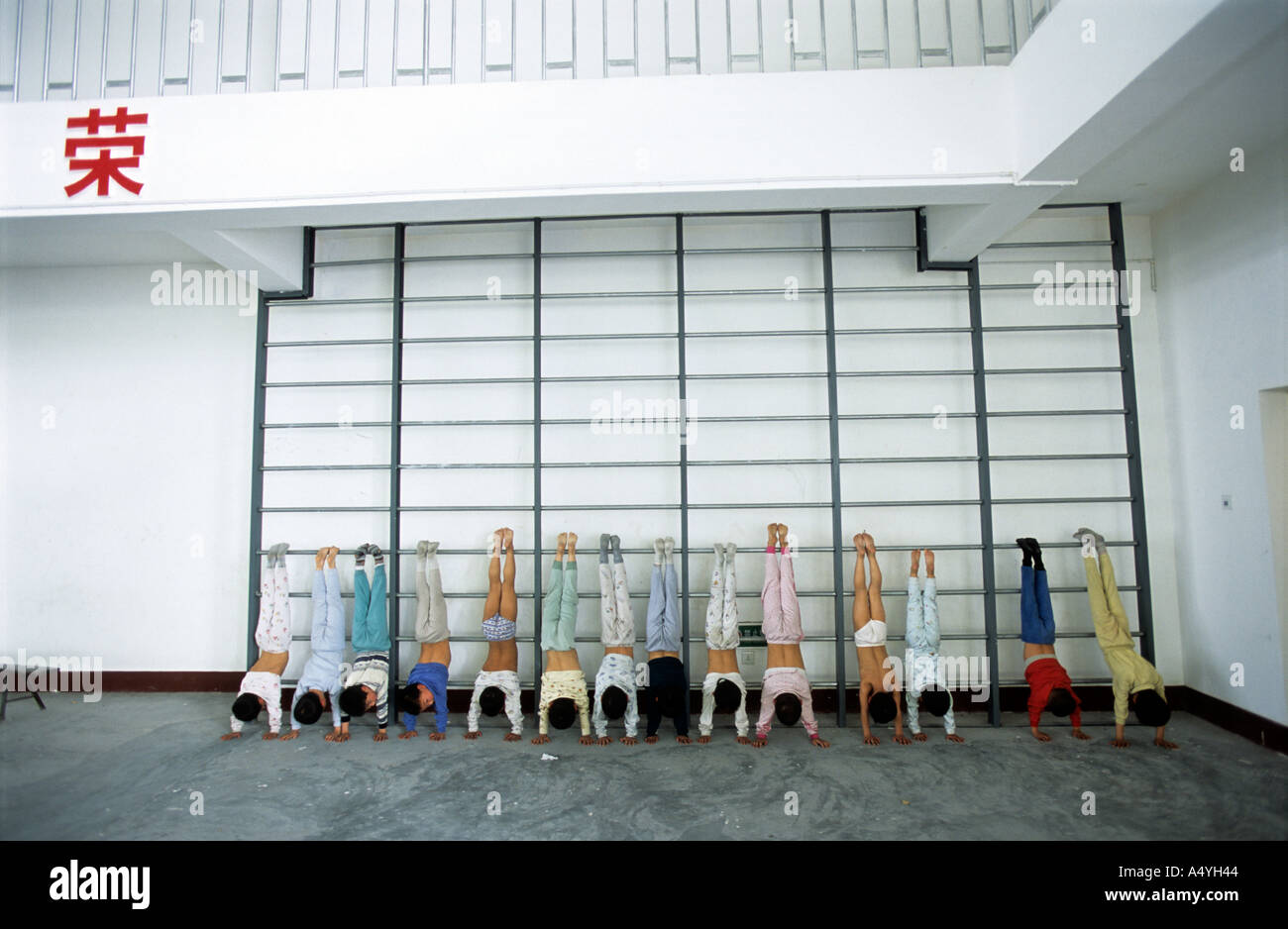 Children practice gymnastics at the Li Xiaoshuang Gymnastics School in ...