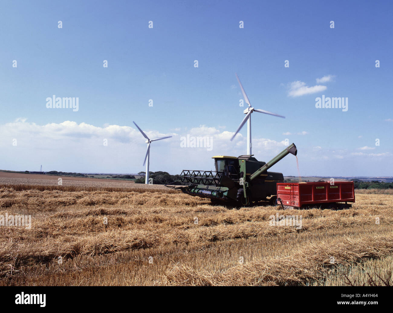 Harvest time on a wind farm in cornwall Stock Photo - Alamy