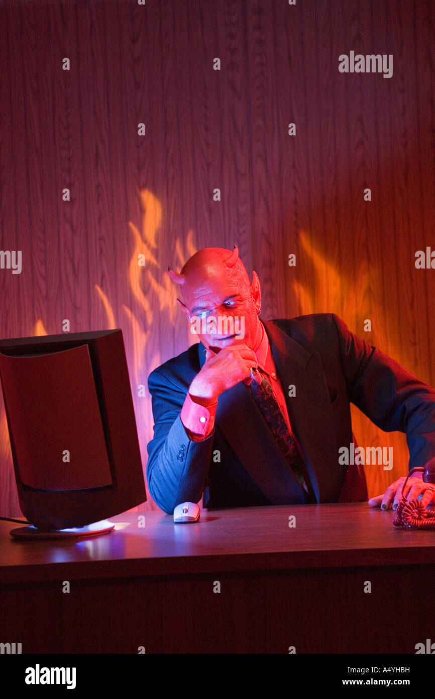 Businessman dressed devil desk hi-res stock photography and images - Alamy