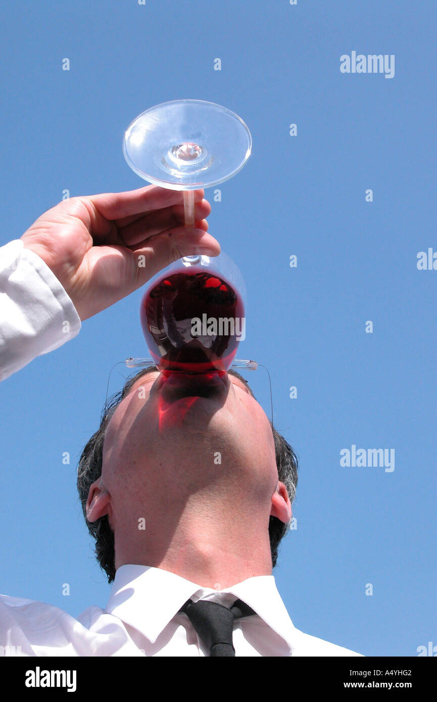 Man drinking red vine Stock Photo - Alamy