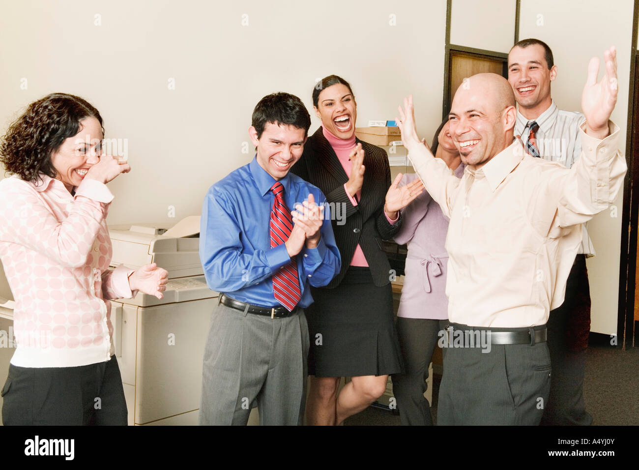 Group of co-workers clapping for businessman Stock Photo - Alamy