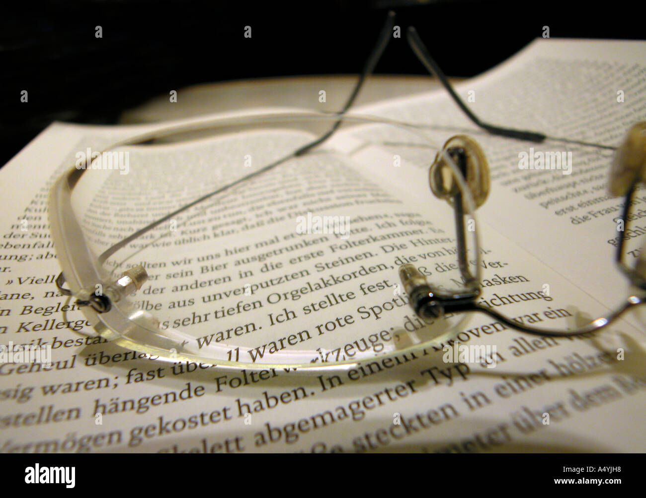 Glasses and book Stock Photo - Alamy