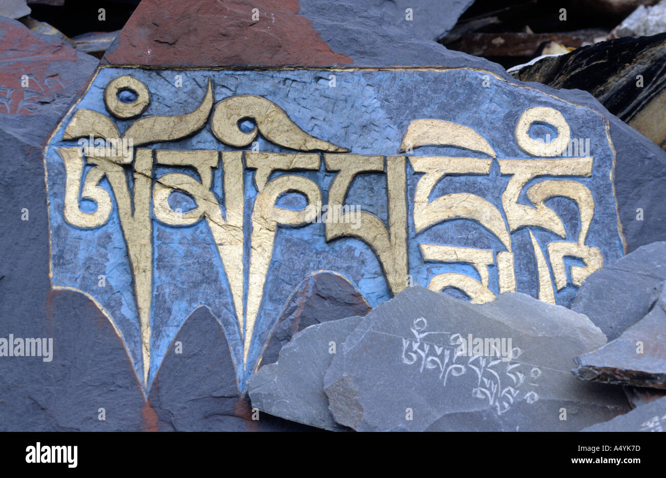 Tibetan script carved in rock in Lhasa Tibet Stock Photo - Alamy