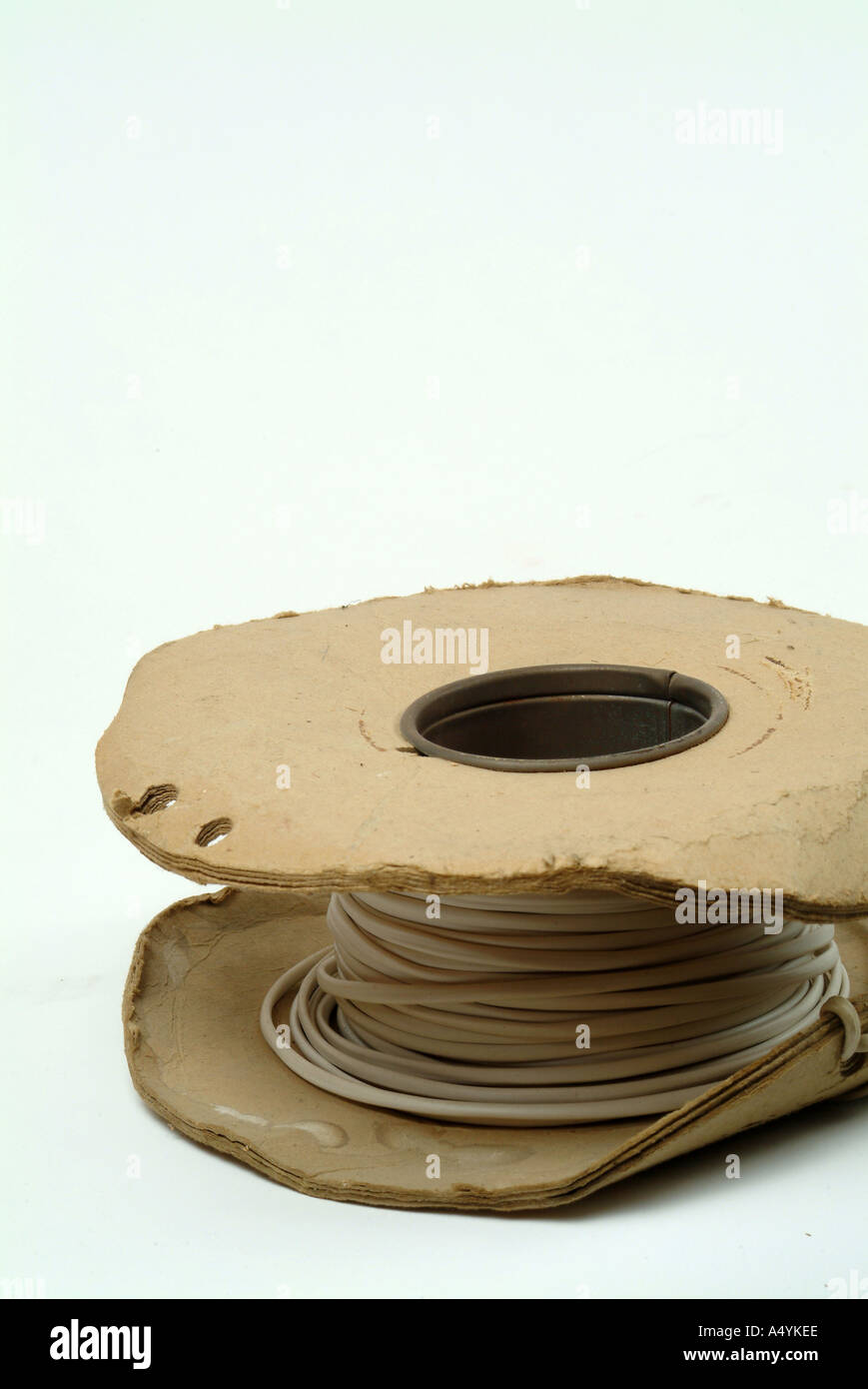 old telephone cable reel on white background Stock Photo - Alamy