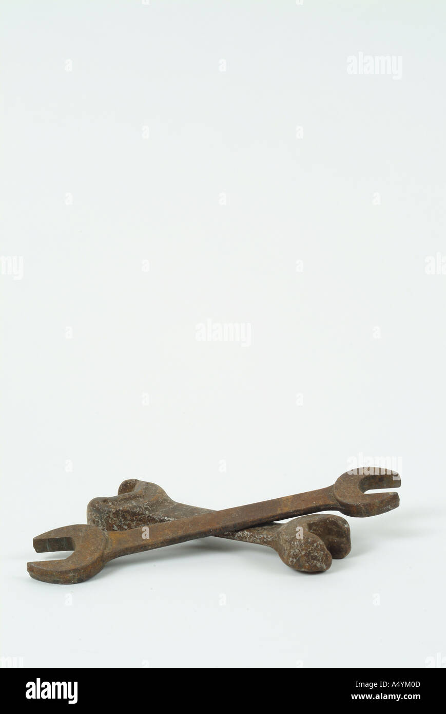 two spanners at the bottom of an empty white space Stock Photo - Alamy