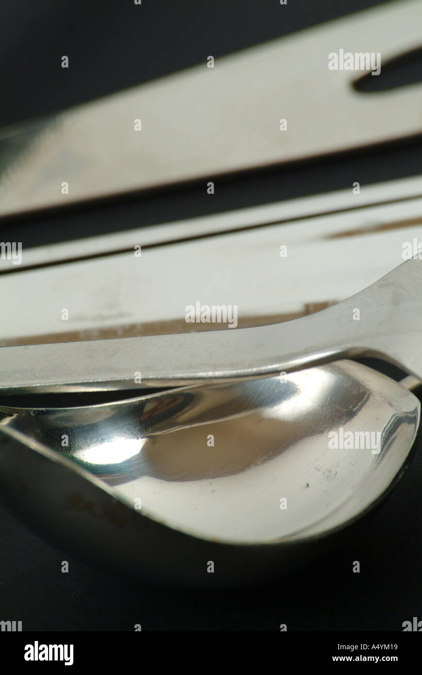 Stainless steel kitchen utensils on a matt black background Stock Photo ...