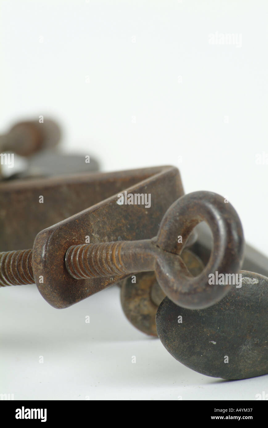 rusty old hand clamps bunched together on a white background Stock ...