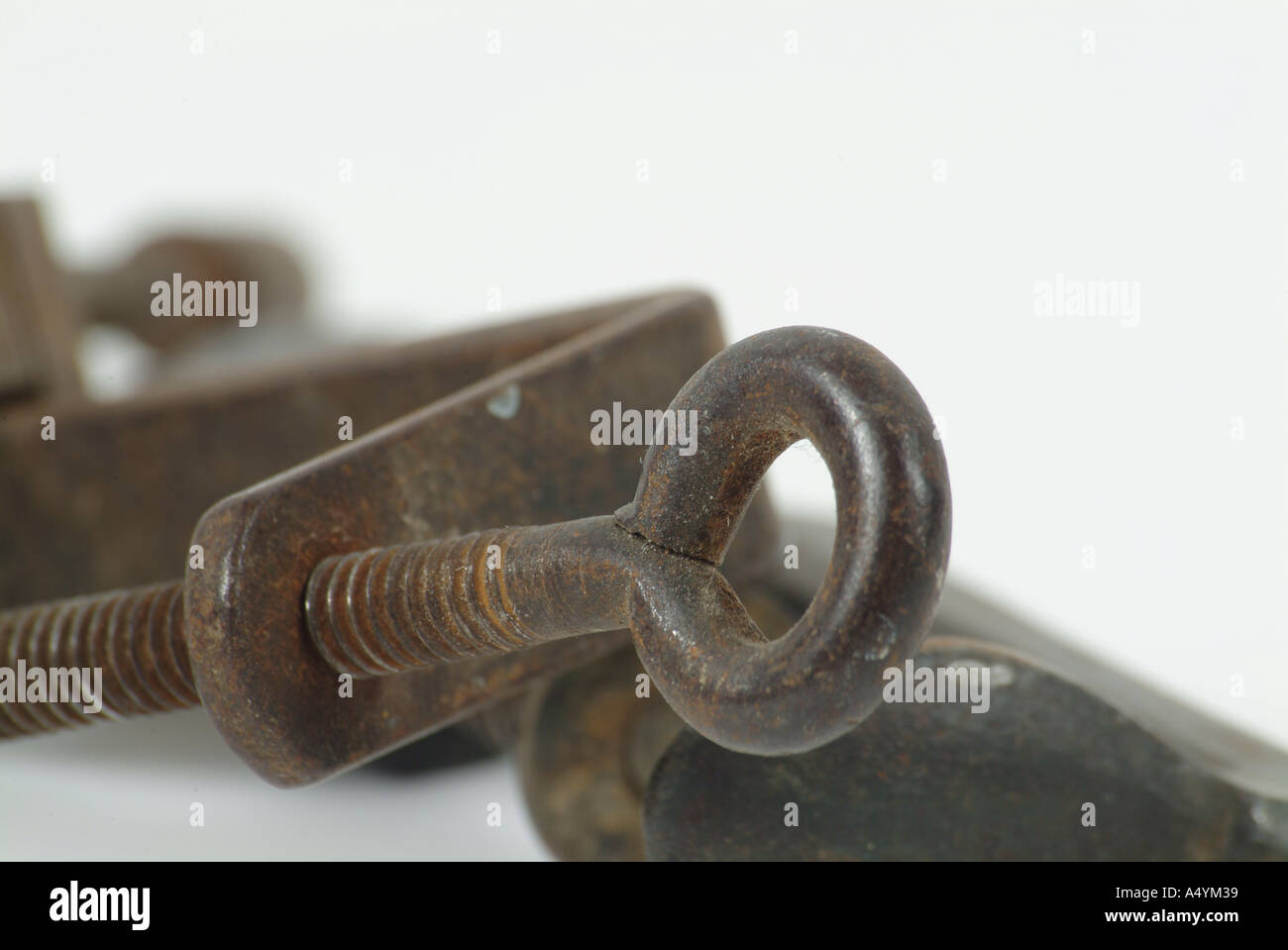 rusty old hand clamps bunched together on a white background Stock ...