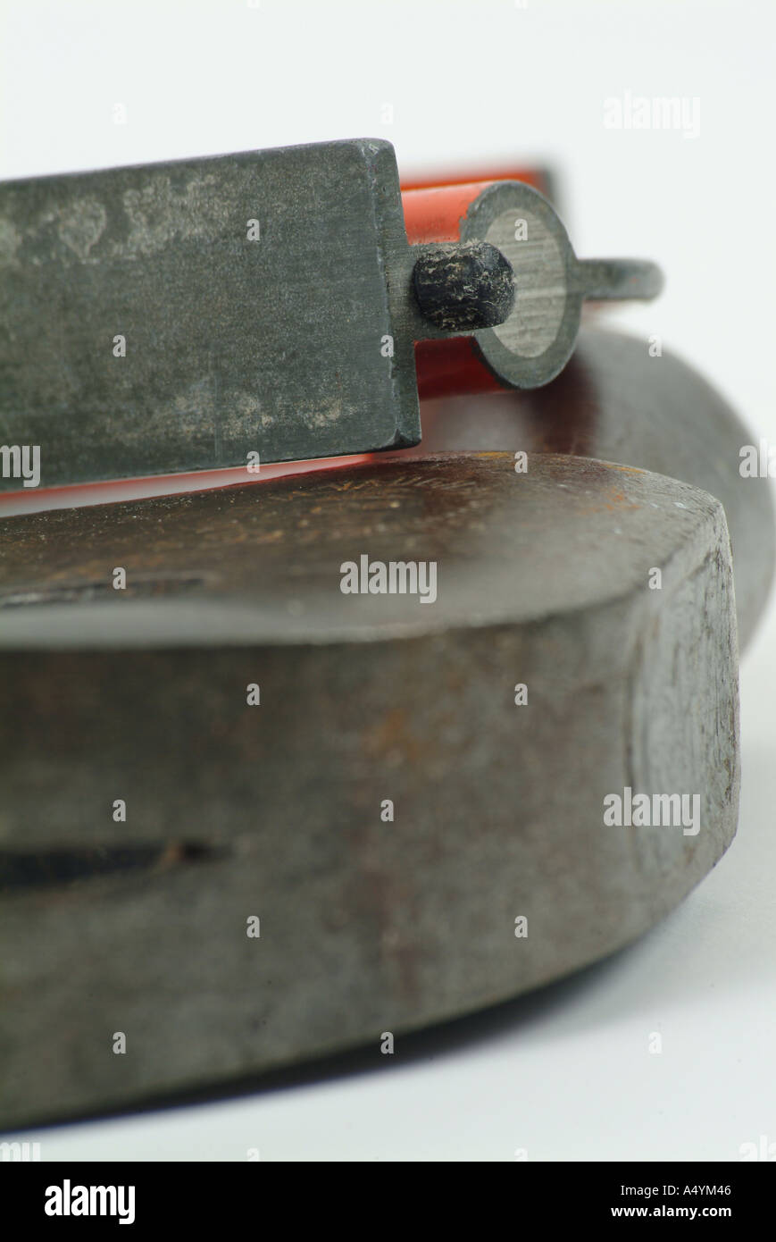 a set square and hammer thrown together on a white background Stock ...