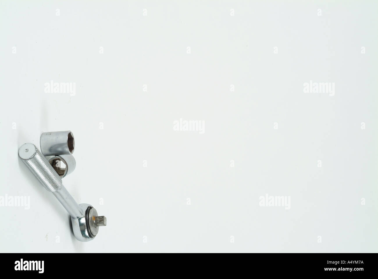 shiny metal socket and handle on a white background Stock Photo - Alamy