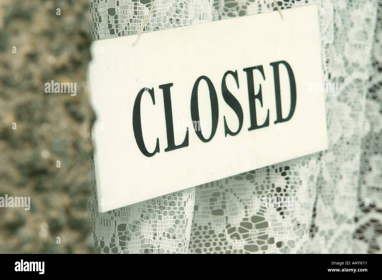 Closed sign in old shop front window with net curtains Kirkcaldy fife ...