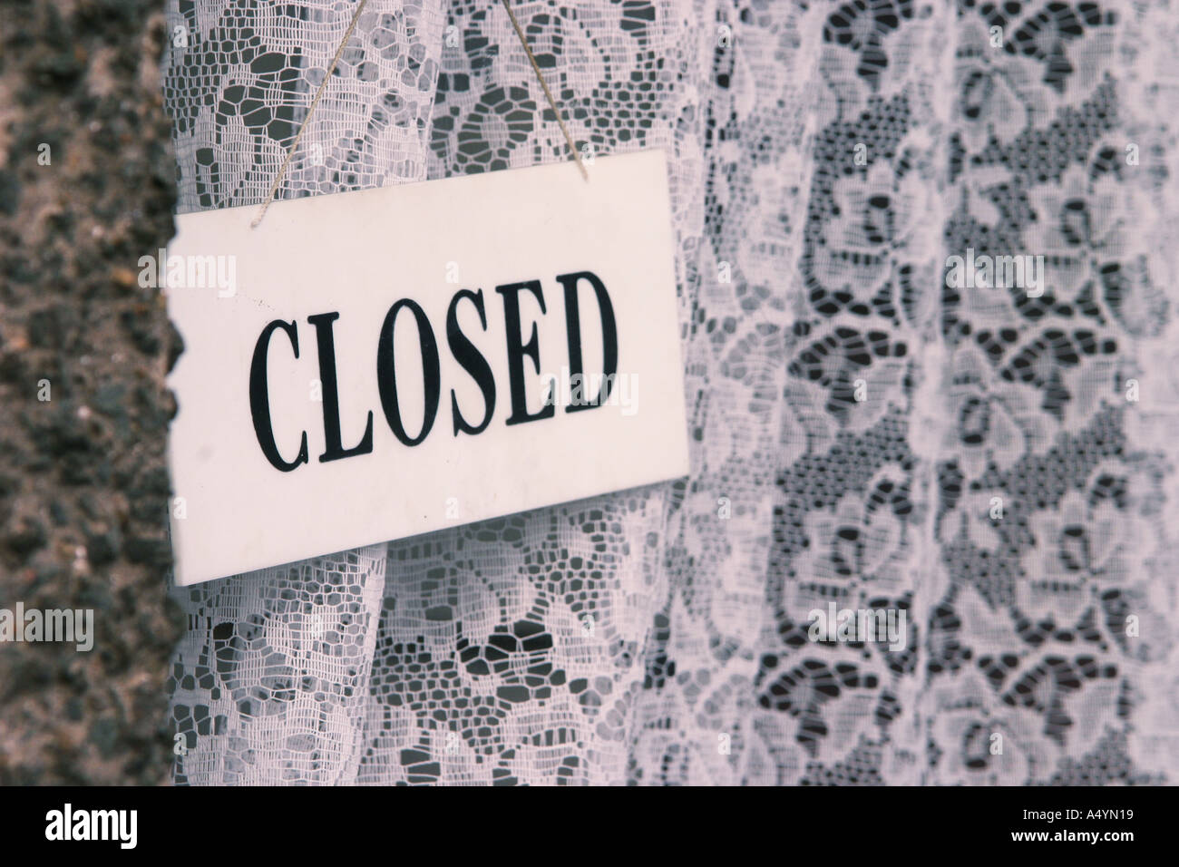 Closed sign in old shop front window with net curtains Kirkcaldy fife ...