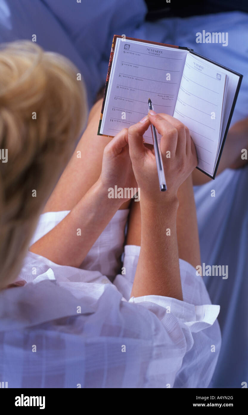 woman writing in her diary Stock Photo - Alamy