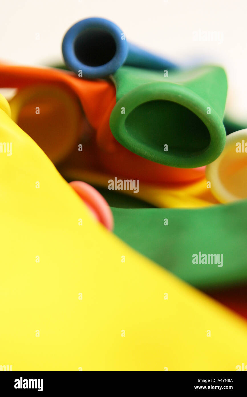 Colourful abstract image of un inflated balloons with the round opening ...