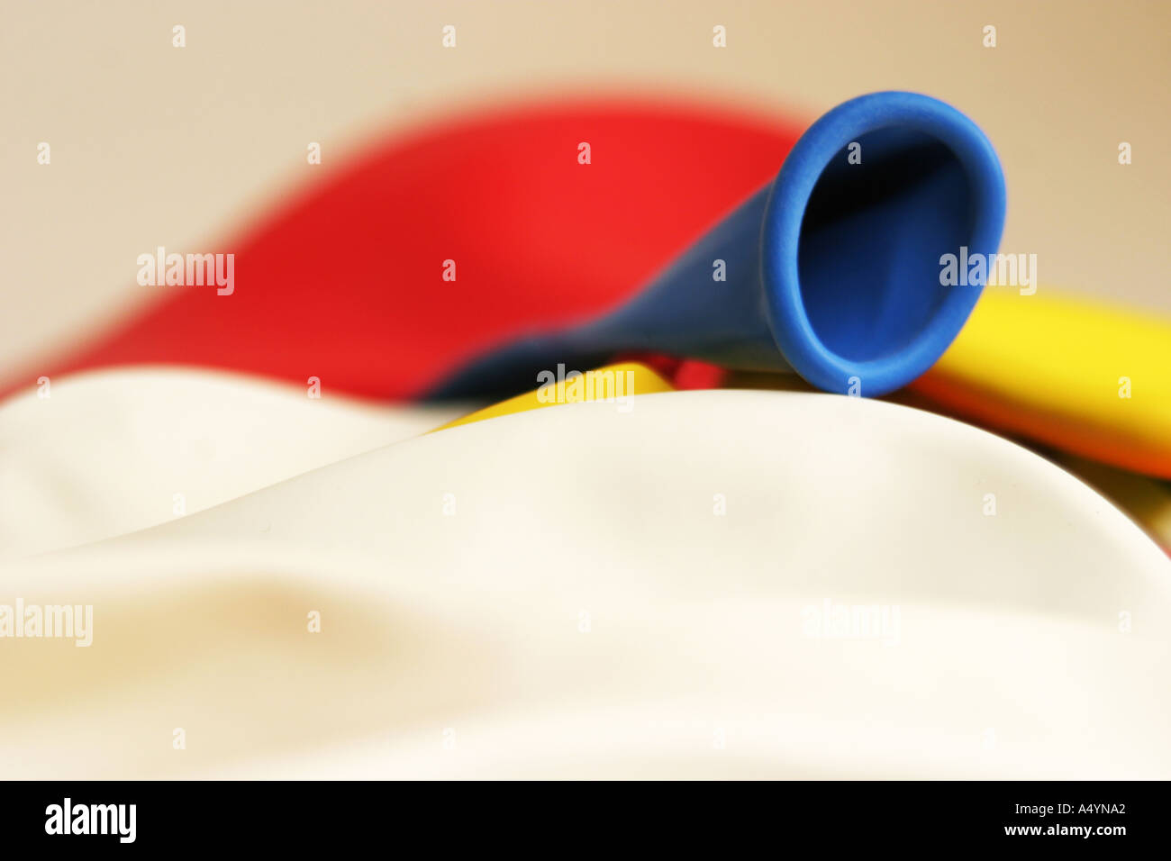 Colourful abstract image of un inflated balloons with the round opening ...
