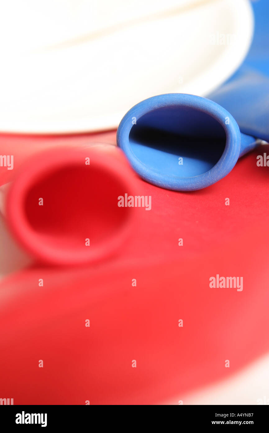 Colourful abstract image of un inflated balloons with the round opening ...