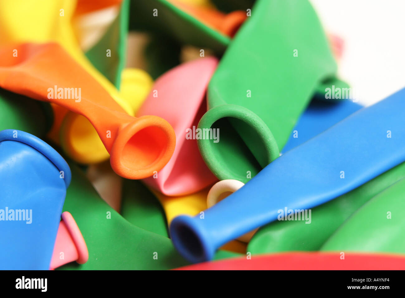 Colourful abstract image of un inflated balloons with the round opening ...
