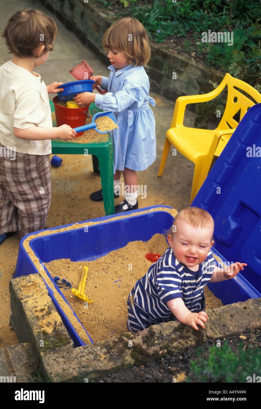 children playing in sandpit Stock Photo - Alamy