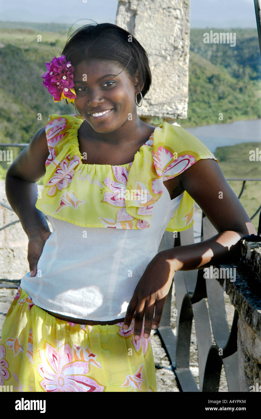 Woman with flower and typical dress of Republic Dominican Stock Photo ...