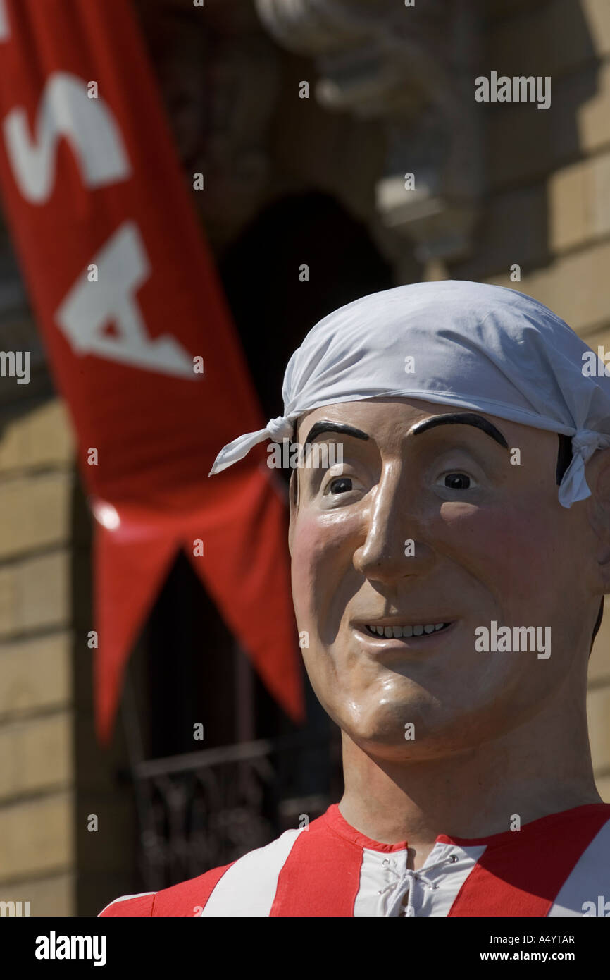 Male gigante (giant) during parade with hankie on head wearing football ...