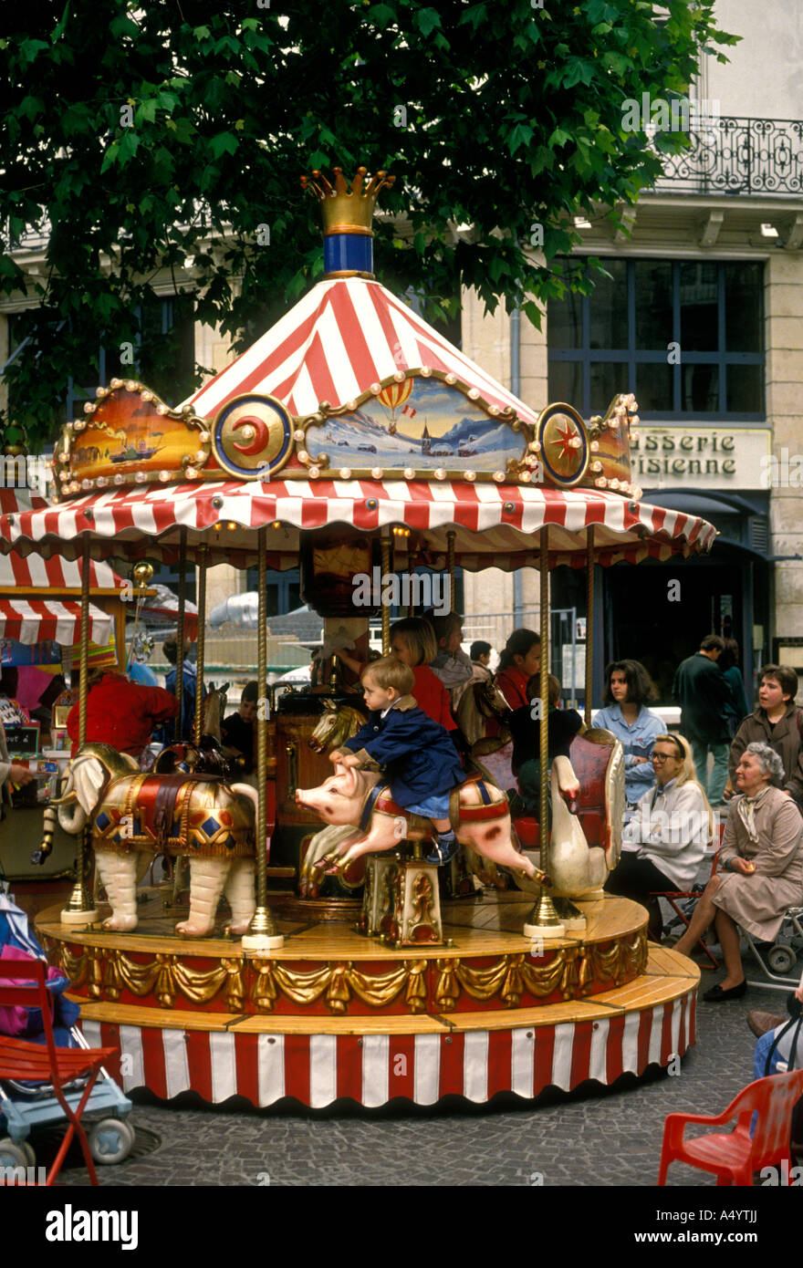 French people, young boy, child, children, carousel, carousel ride ...
