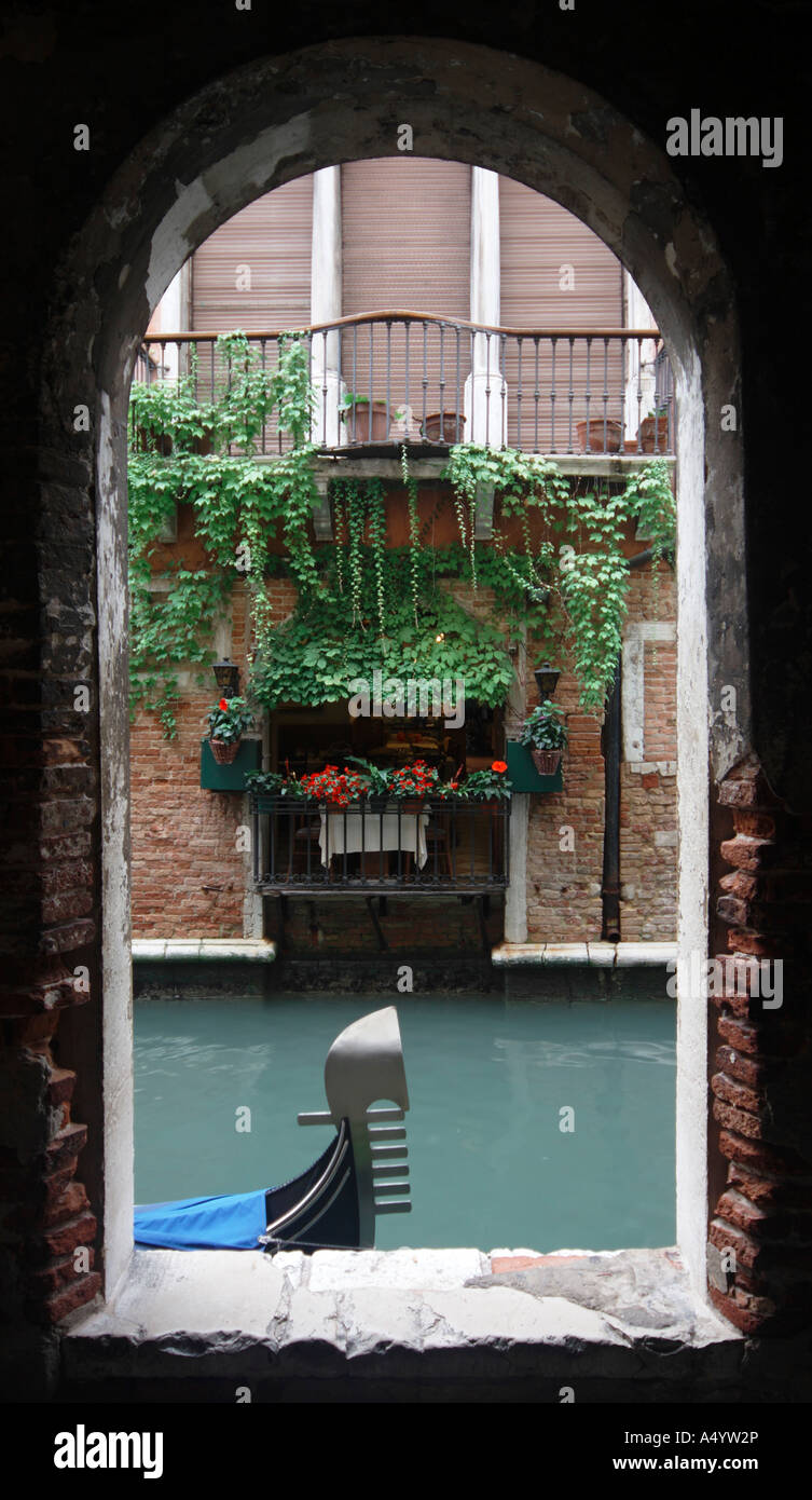 Gondola through Venetian Window Frame Stock Photo - Alamy