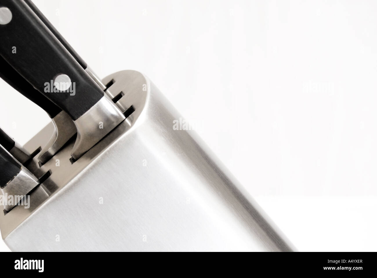 Chrome knife-block with black handled knives Stock Photo - Alamy