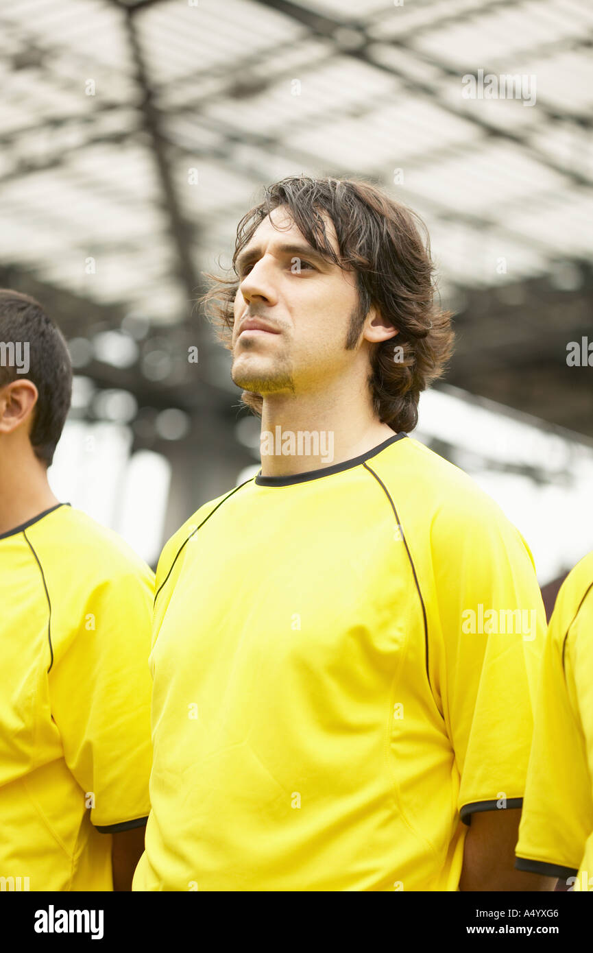 Footballers in yellow Stock Photo - Alamy