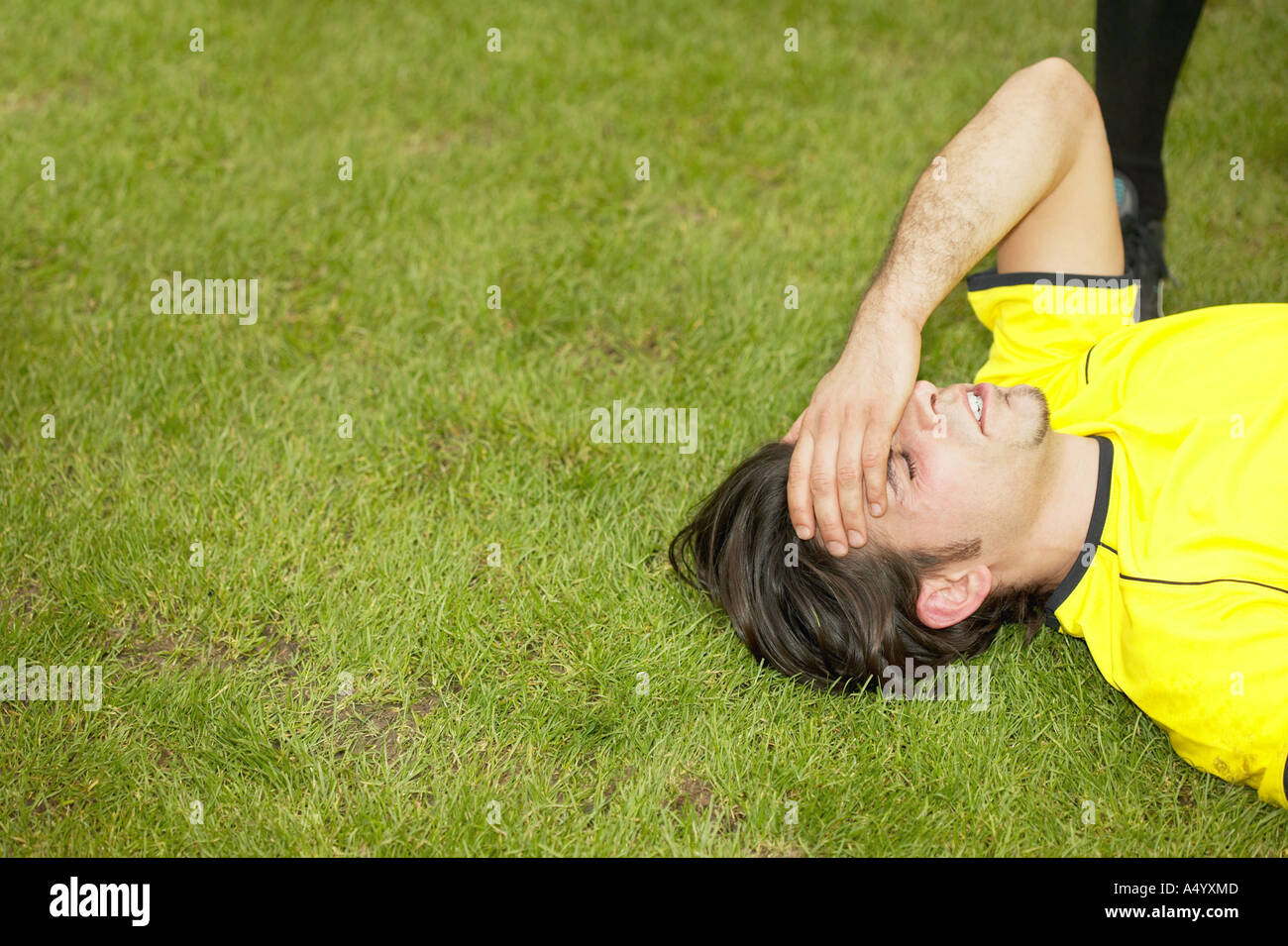 Footballer injury lying hi-res stock photography and images - Alamy