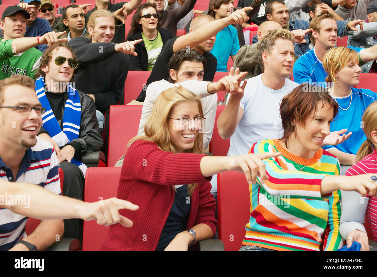 Football crowd pointing Stock Photo - Alamy