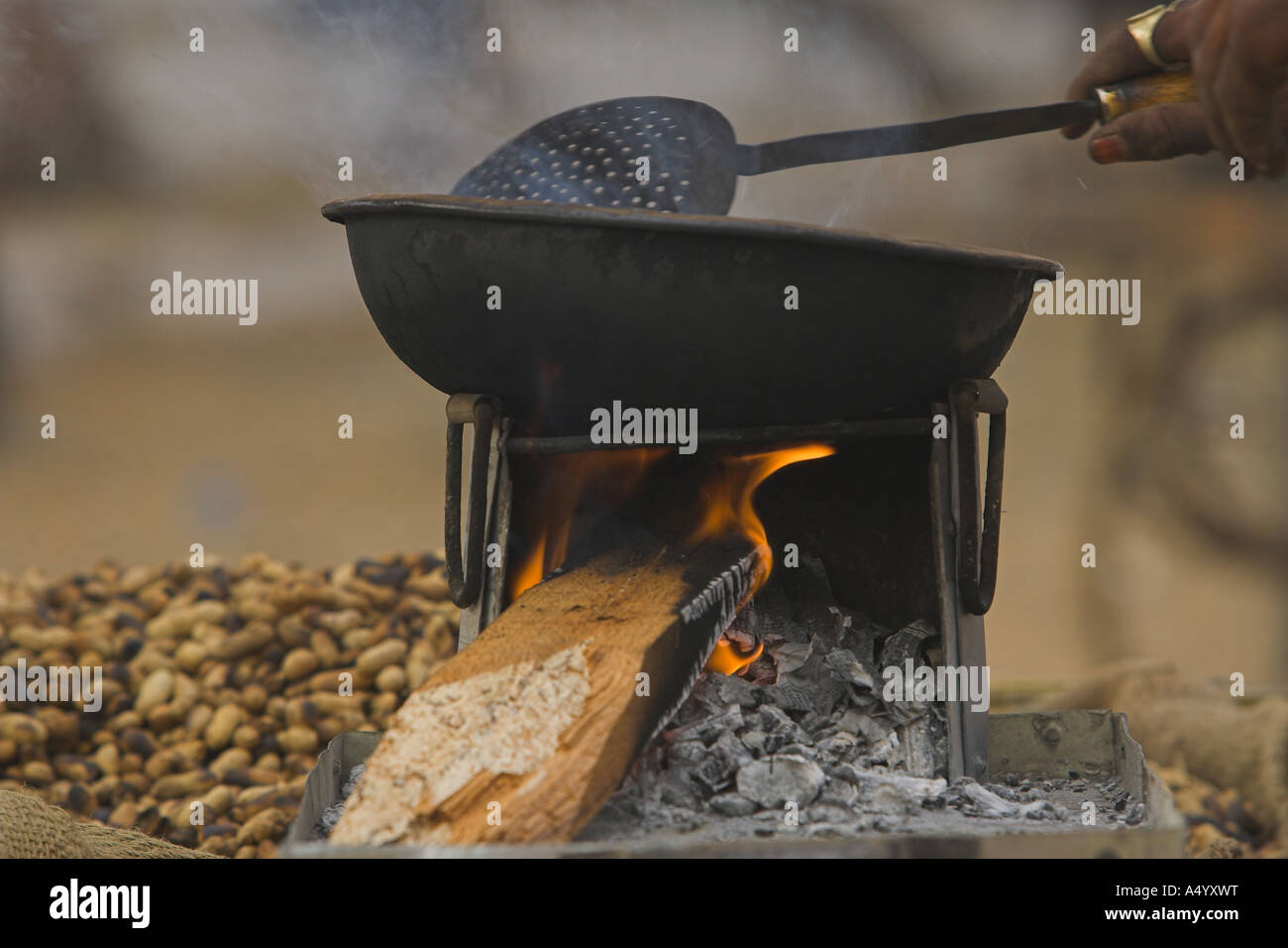 Nuts coking in a pan - India Stock Photo - Alamy