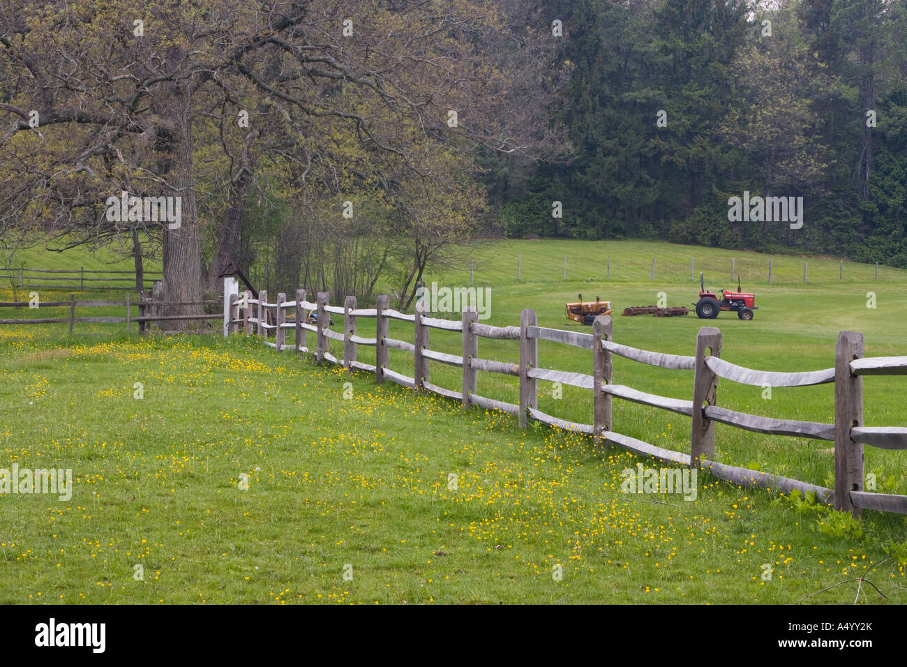 A split rail fence and tractor in Ipswich Massachusetts USA Stock Photo ...