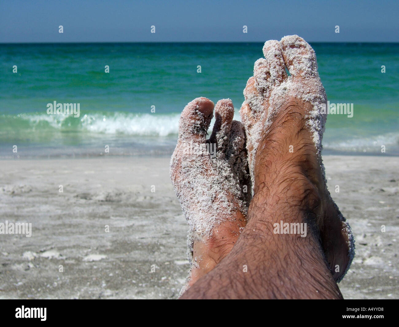 A pair of feet covered in sand hi-res stock photography and images - Alamy