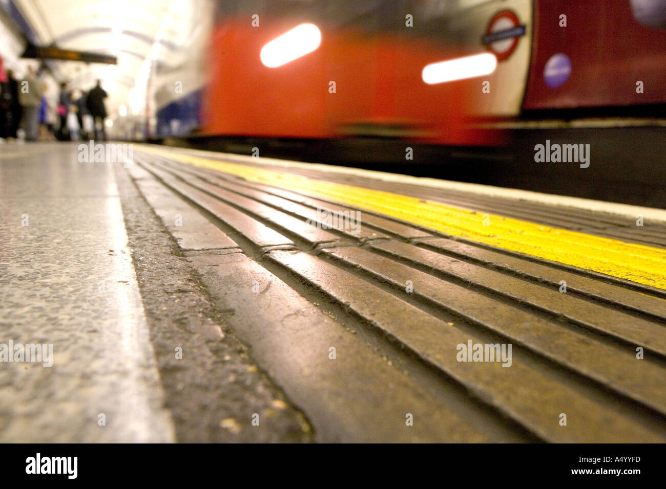 Speeding Tube train entering a station London England Stock Photo - Alamy