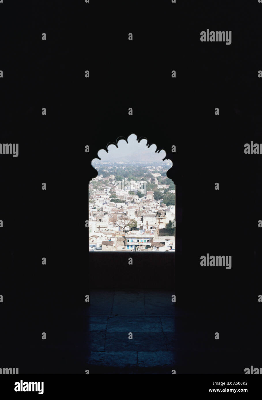 Cityscape seen through arched window Stock Photo - Alamy