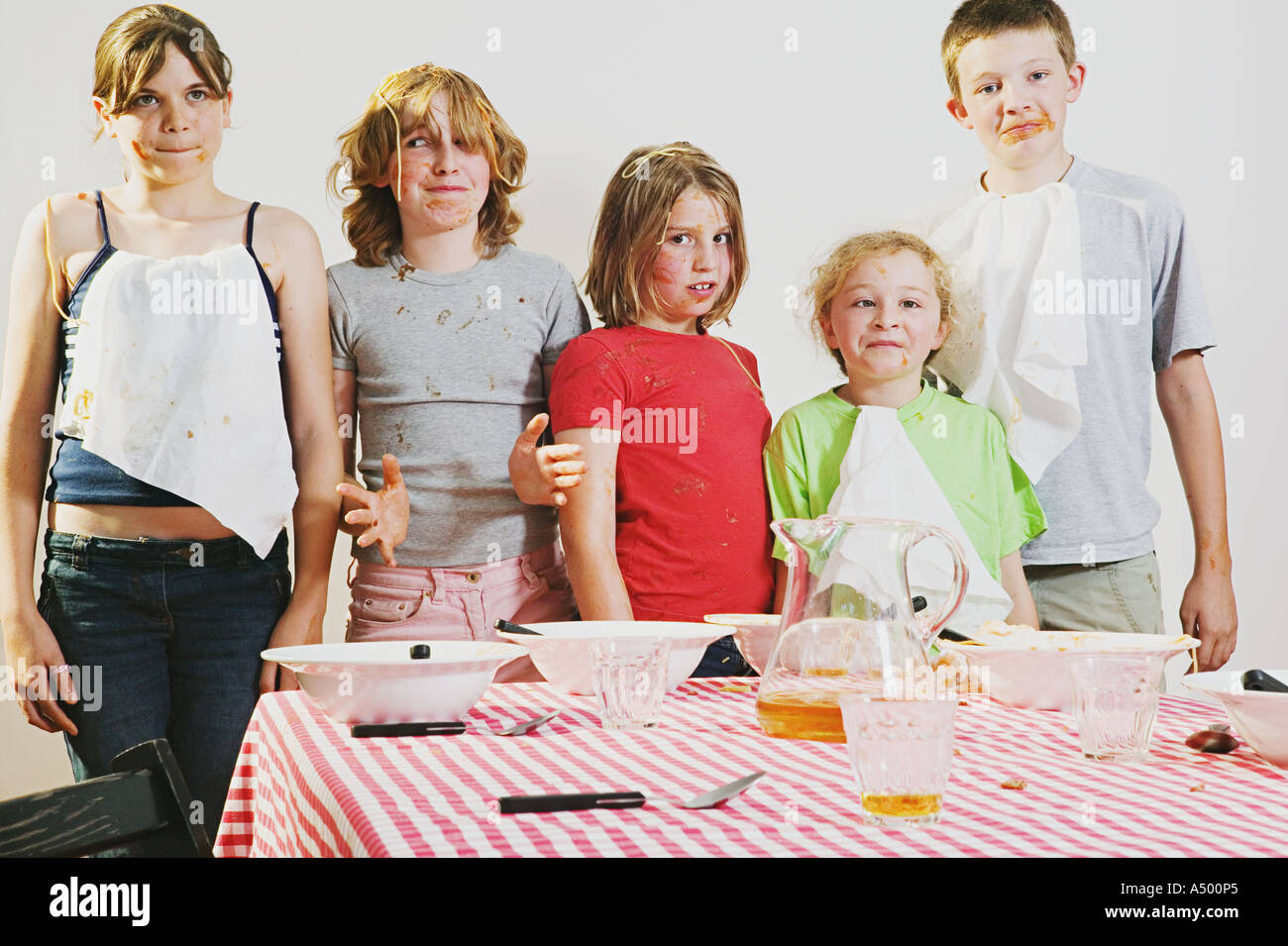 Messy children looking guilty Stock Photo - Alamy