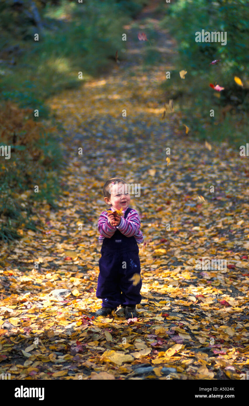 A young girl enjoys fall on an old logging road on the northern slopes ...