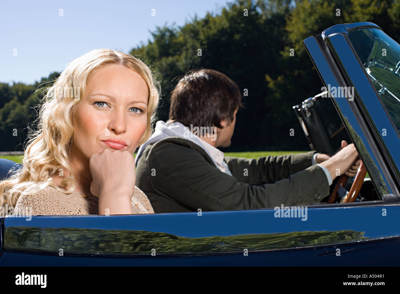 Couple in convertible Stock Photo - Alamy